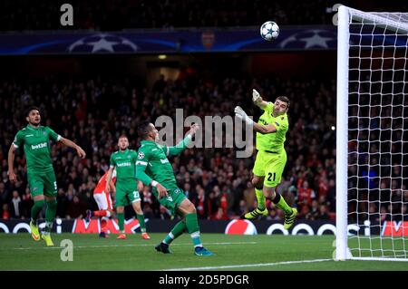 Arsenal's Alexis Sanchez (background) scores his side's first goal of ...