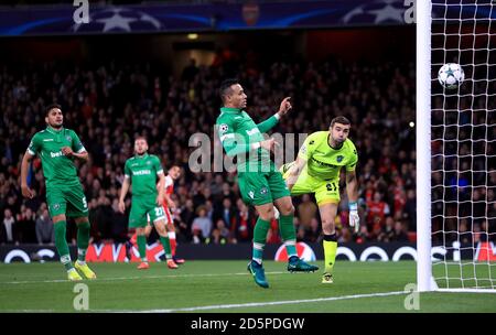 Arsenal's Alexis Sanchez (background) scores his side's first goal of ...