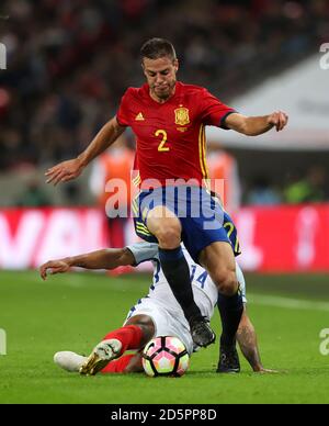 Spain's Cesar Azpilicueta, left, and England's Nathaniel Clyne jump to ...