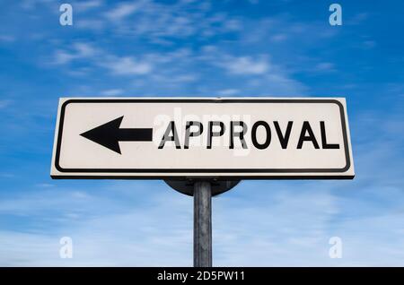 Approval road sign on sky background Stock Photo - Alamy