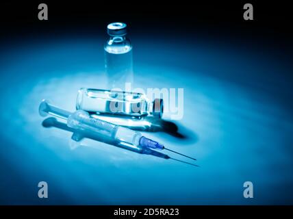 Medicine and health concept. Syringe, human figure made of pills and ...