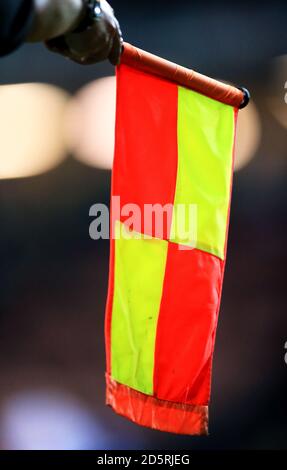 The linesman holds the offside flag Stock Photo - Alamy