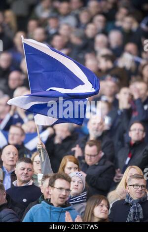 Scotland fans wave a Saltire Stock Photo - Alamy