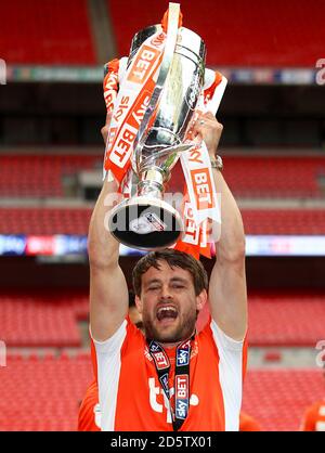 Blackpool's Andy Taylor lifts the trophy after the final whistle Stock ...
