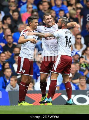 Burnley's Sam Vokes (centre) celebrates with Phil Bardsley (left) and ...