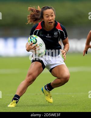 Hong Kong's Chong Ka Yan makes a tackle Stock Photo - Alamy