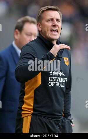 Hull City coach Tony Pennock puts his hand on Greg Docherty’s head as ...