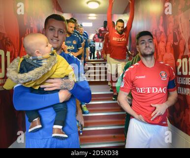 Truro City captain Ben Gerring (with his young child) in the tunnel ...