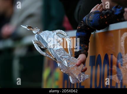 Leatherhead's fan with tinfoil FA Cup trophy during the game Stock ...