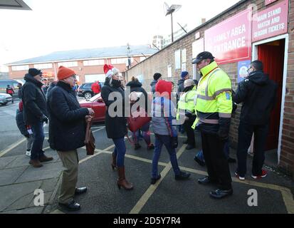 Supporters make their way through the turnstiles before the Sky Bet ...