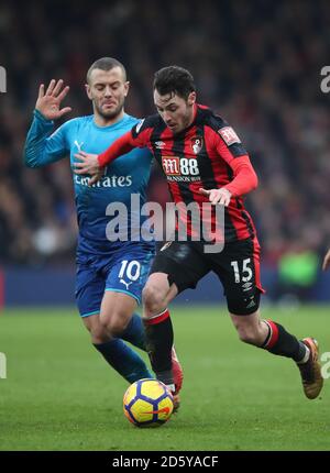 Bournemouth's Adam Smith (left) and Arsenal's Gabriel Martinelli battle ...