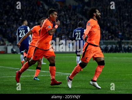 Liverpool's Mohamed Salah, right, celebrates after scoring his side's ...