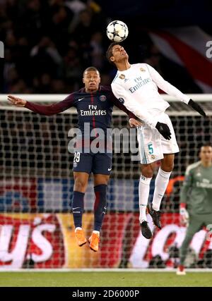 Real Madrid's Kylian Mbappe, left, kicks the ball during the Champions ...