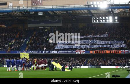 The players from both sides line up to sing the national anthem ahead ...