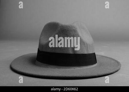Fedora Hat Against Gray Background In Black And White Stock Photo - Alamy