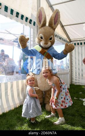 Racegoers meet Peter Rabbit during Kid's Carnival Day at Warwick Races ...