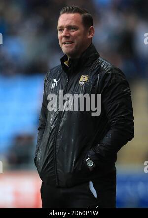 Notts County's manager Kevin Nolan applauds the travelling supporters ...