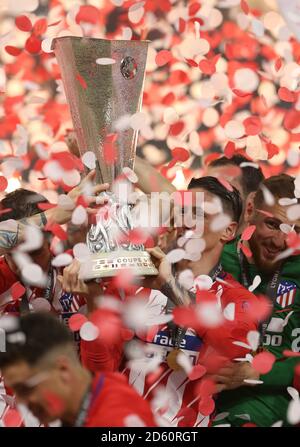 Fernando Torres of Atletico Madrid lifts the trophy with Atletico ...