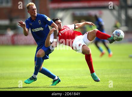 Fleetwood Town's Bobby Grant (right) and AFC Wimbledon's Michael ...