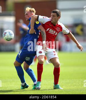 Fleetwood Town's Bobby Grant (right) and AFC Wimbledon's Michael ...