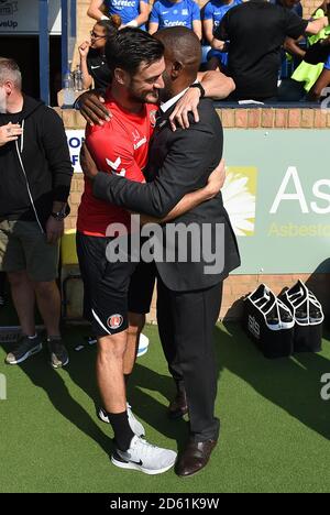 Charlton Athletic coach Jonnie Jackson (left) greets his former manager ...