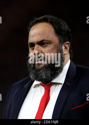 Olympiacos club owner Evangelos Marinakis, center, holds the trophy ...