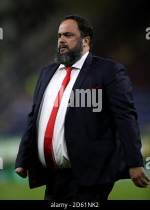 Olympiacos club owner Evangelos Marinakis, center, raises the trophy ...