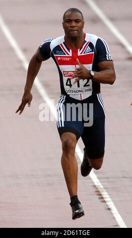 Great Britain's Mark Lewis-Francis (L) celebrates winning the 4x100 ...