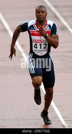 Great Britain's Mark Lewis Francis (top) runs next to USA's Olympic ...