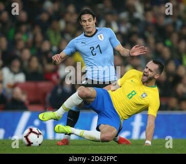 Uruguay's Edinson Cavani, front, and Brazil's Lucas Verissimo head for the ball during a ...