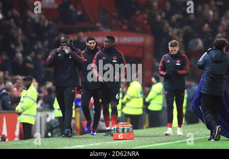 Manchester United players warm up before the Premier League match at ...