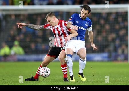 Lincoln City's Harry Anderson (left to right), Tom Pett (centre) and ...