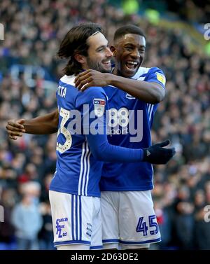 Birmingham City's Jota (left) and Wes Harding warming up on the pitch ...