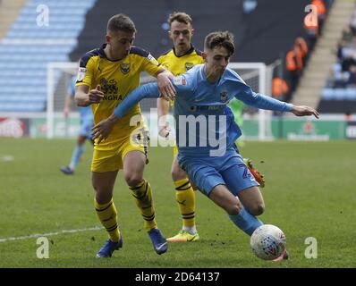 Oxford United's Cameron Brannagan (left) celebrates at the end of the ...