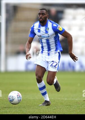 Kane Vincent-Young of Colchester United tries to find a way past the ...