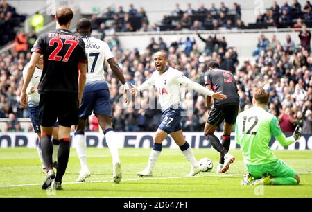 Lucas Moura of Tottenham looks dejected as he takes a seat on the bench ...