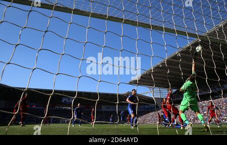 Liverpool goalkeeper Alisson Becker saves at the feet of Paris Saint ...