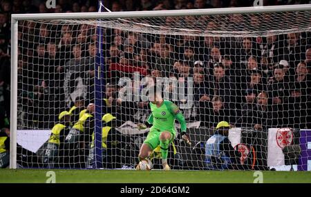 Chelsea goalkeeper Kepa Arrizabalaga makes a save with his legs during ...