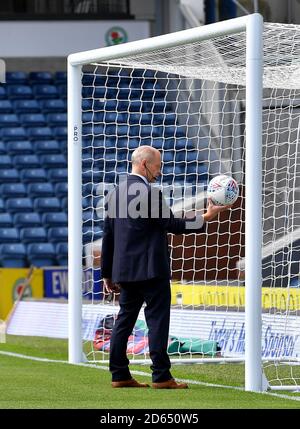 Match referee Andy Woolmer tests the goal line technology before kick ...