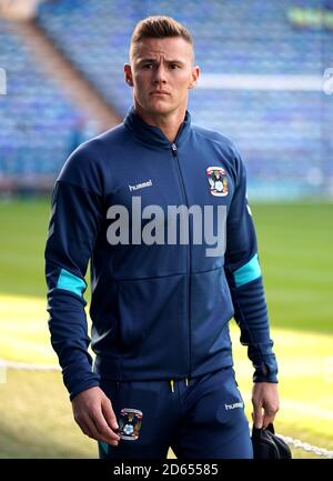 Coventry City goalkeeper Ben Wilson makes his way out onto the pitch to ...