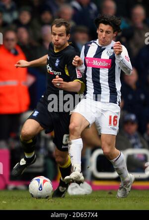 West Bromwich Albion's Robert Koren (R) celebrates scoring his sides ...