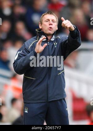 Manchester City manager Stuart Pearce celebrates his teams fourth goal ...