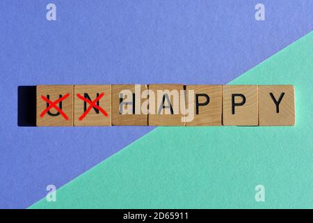 Unhappy, word with prefix Un crossed out leaving word with opposite ...