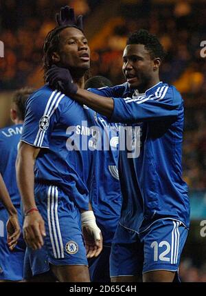 Chelsea's Didier Drogba (left) celebrates scoring his sides third goal ...