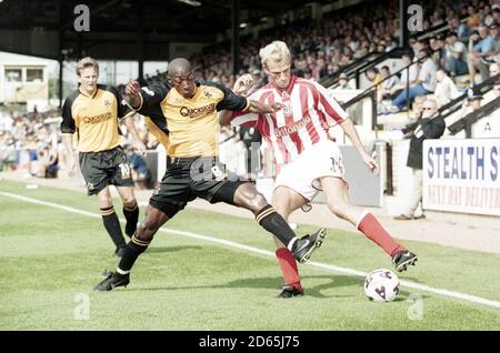 Cambridge United's Dean Walling and Stoke's James O' Connor battle for ...