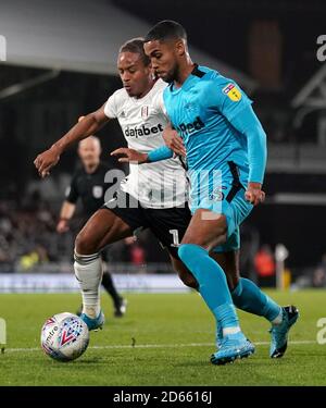 Fulham's Bobby Reid (left) and Derby County's Max Lowe battle for the ...
