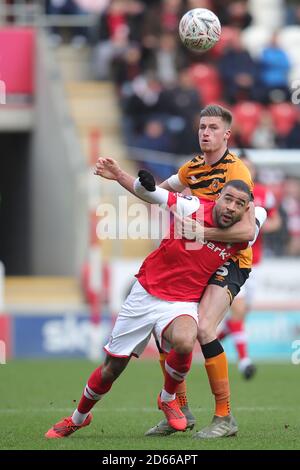 Rotherham United's Kyle Vassell (front) and Hull City's Reece Burke ...
