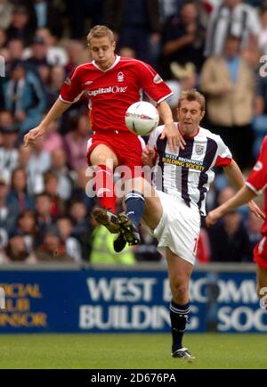 West Bromwich Albion's Rob Hulse and Burnley's Graham Branch battle for ...