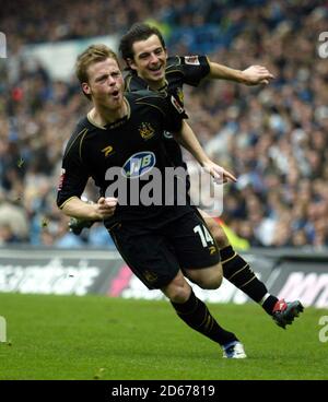 Wigan Athletic's Leighton Baines (c) celebrates scoring the opening ...