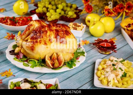 Thanksgiving holiday table with traditional festive food - turkey ...